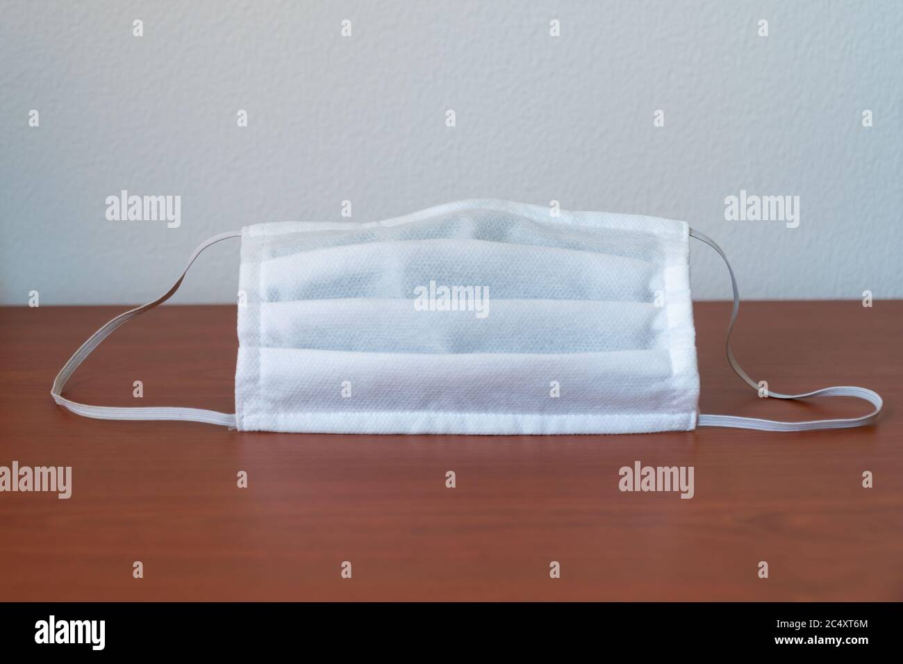 A re-usable white face mask used against protection from germs and ...