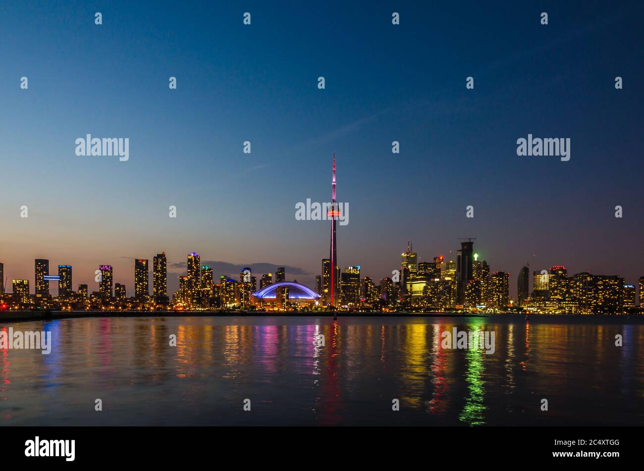 Skyline of Toronto over Ontario Lake after sunset Stock Photo - Alamy