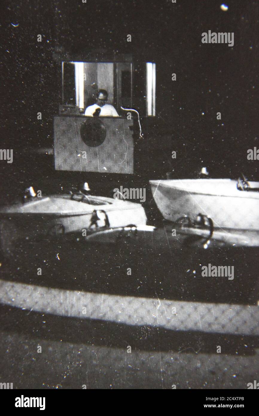 Fine 70s vintage black and white photography of a carny worker amidst ...