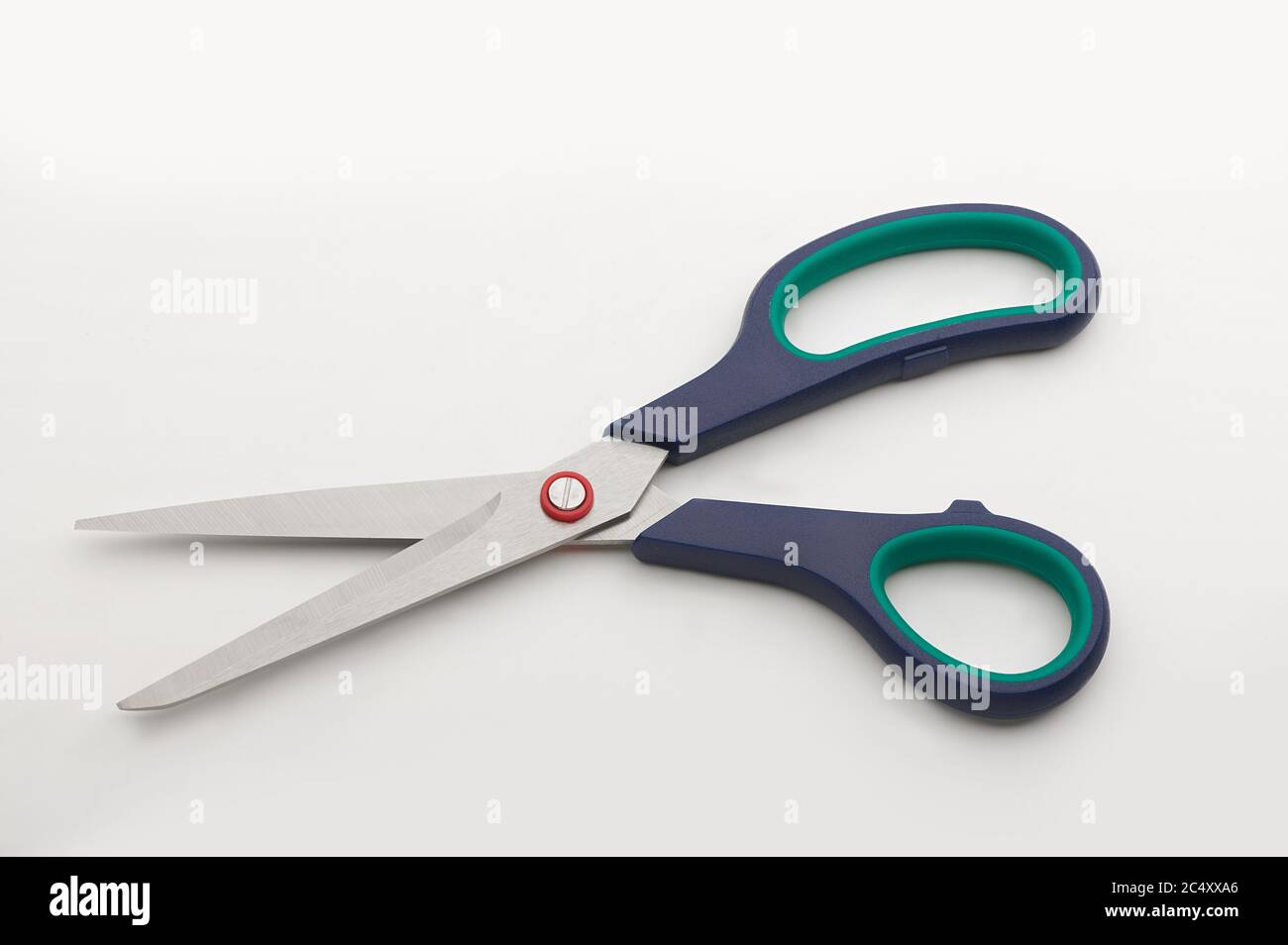 Modern scissors on a white background Stock Photo - Alamy