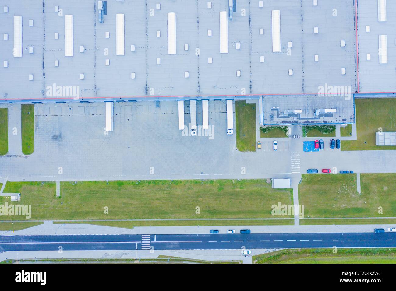 Aerial Shot of Industrial Warehouse Loading Dock where Many Truck with ...