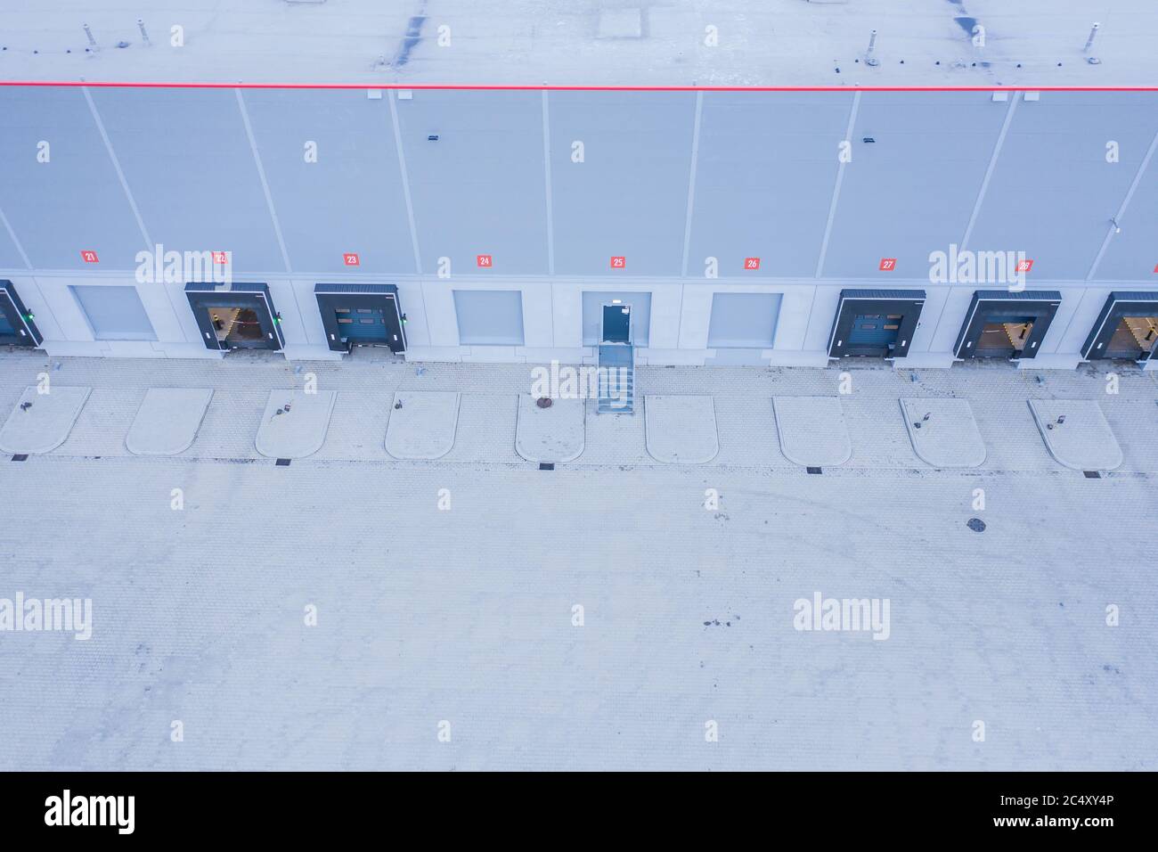 Front view of loading docks of a modern logistics center. Logistics ...