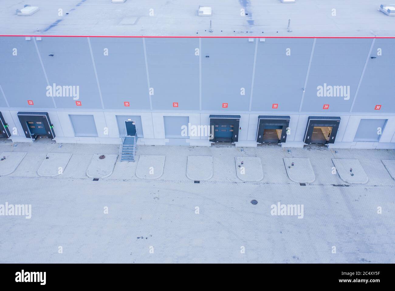 Front view of loading docks of a modern logistics center. Logistics ...