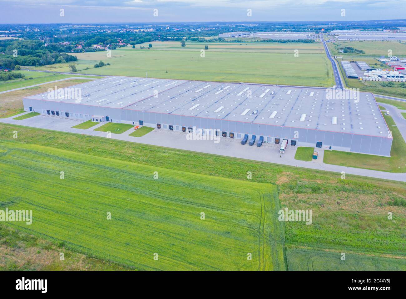 Aerial Shot of Industrial Loading Area where Many Trucks Are Unloading ...