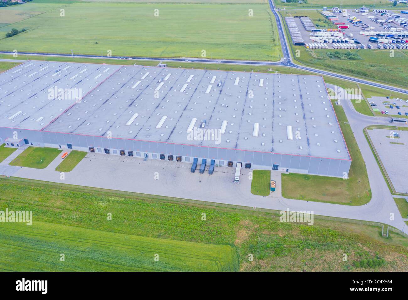 Aerial Shot of Industrial Loading Area where Many Trucks Are Unloading ...