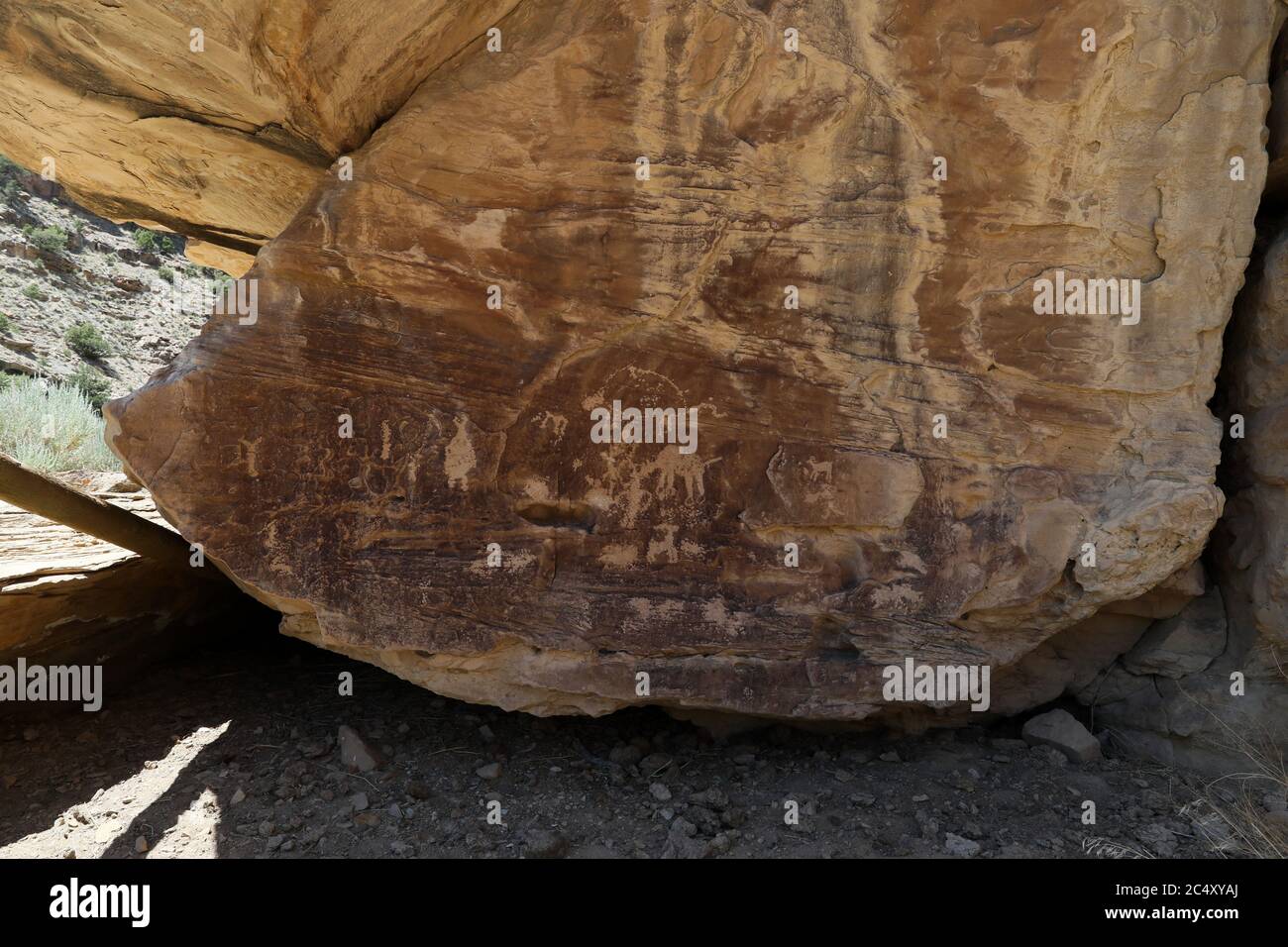 Ancient Native American Indian rock art petroglyph cave entrance Utah ...