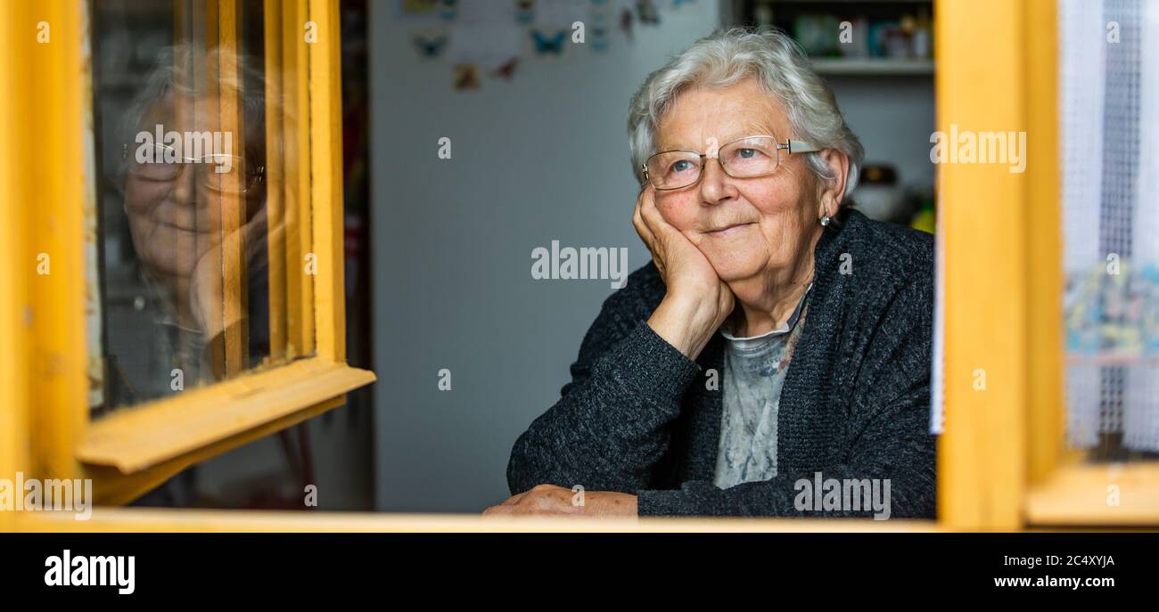 Grandma looking out window hi-res stock photography and images - Alamy