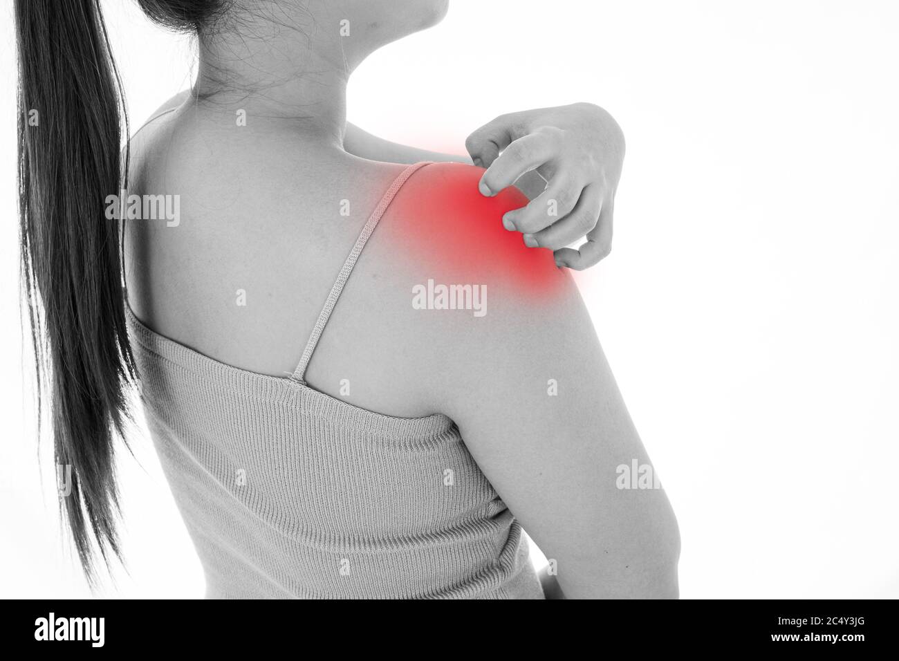 Black and white shot of female scratching her shoulder on isolated ...