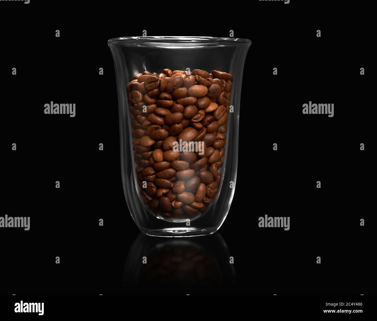 double wall glass with coffee beans isolated on black background with ...