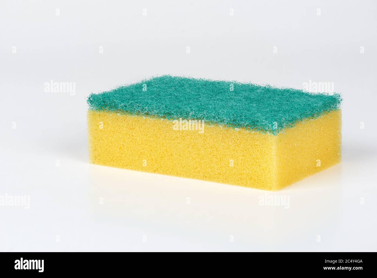 yellow sponge isolated on a white background Stock Photo - Alamy
