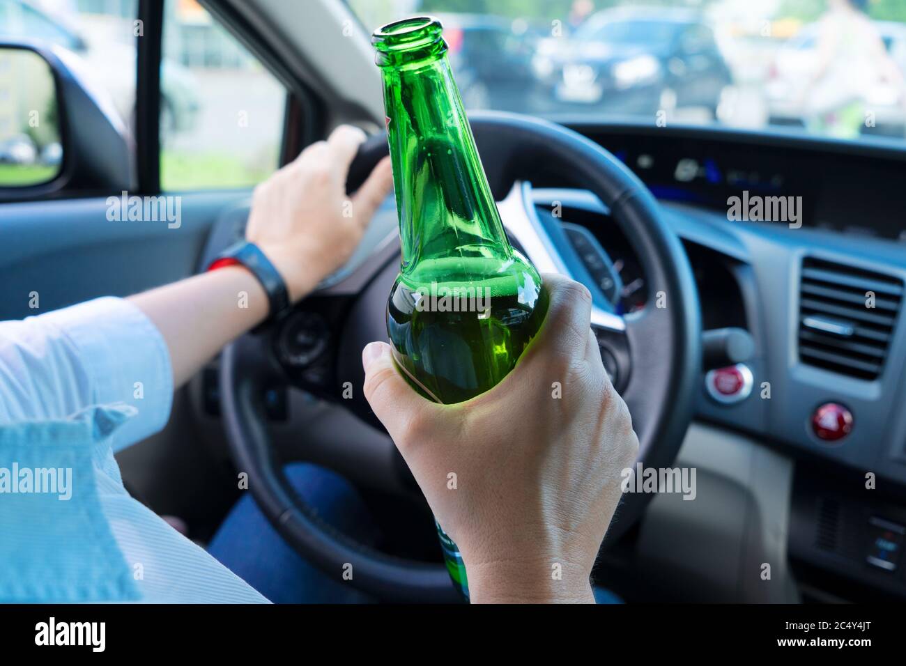 Drunk woman driving car beer hi-res stock photography and images - Alamy