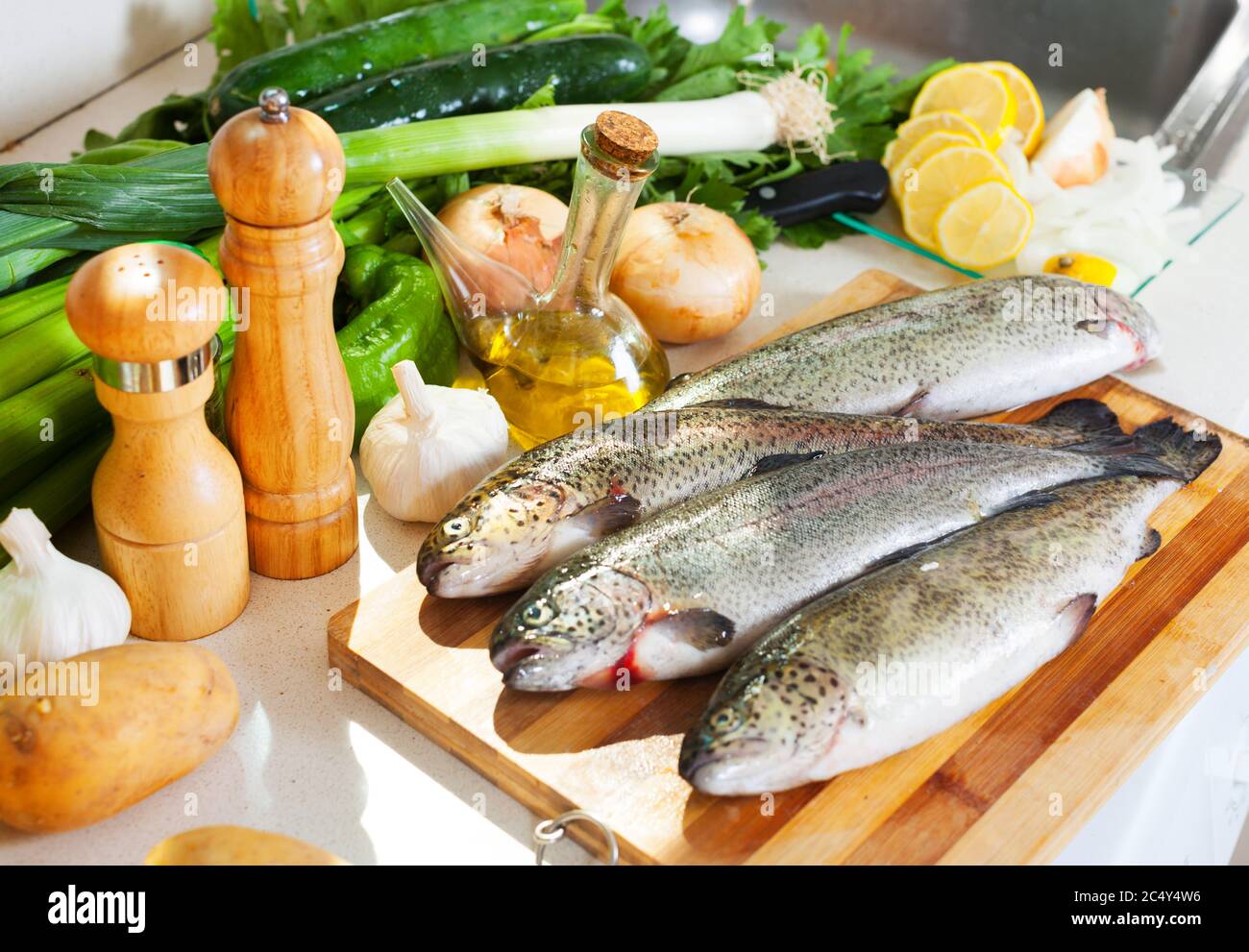 fresh trout fish in kitchen Stock Photo - Alamy