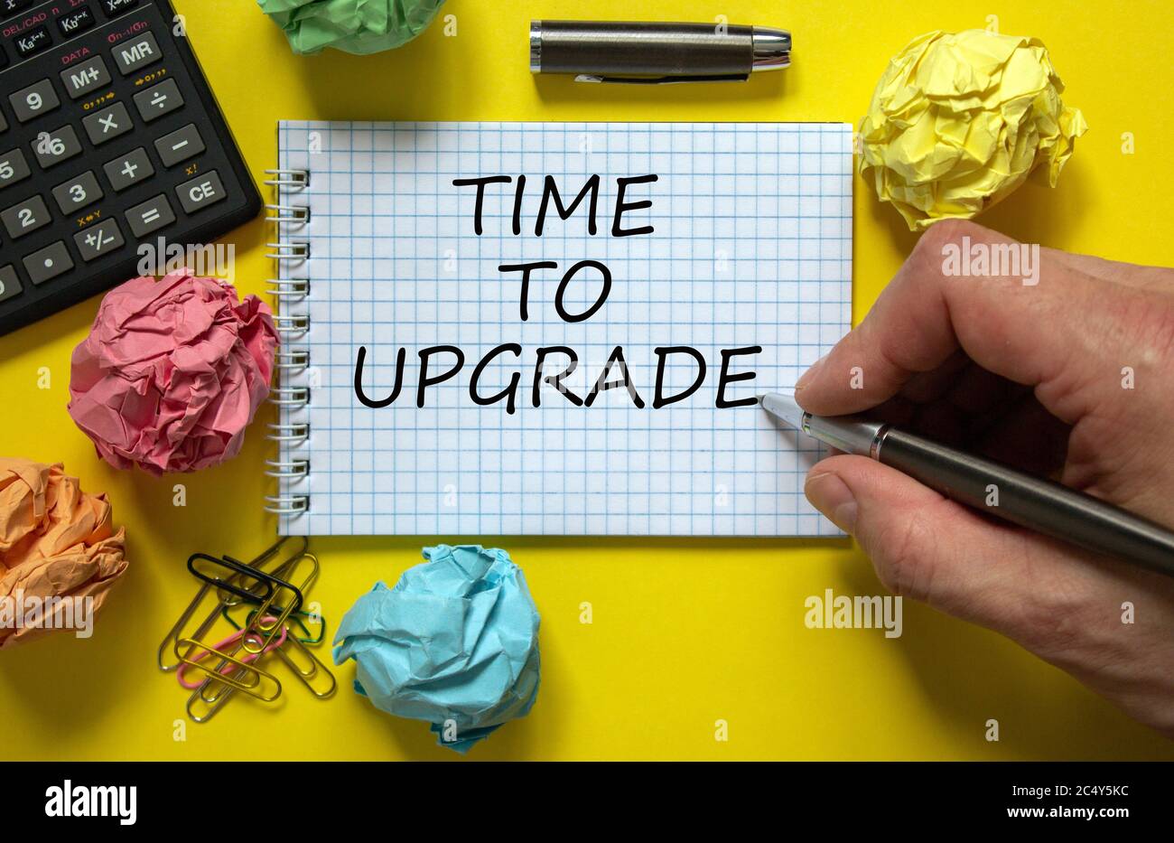 Mail hand writing 'time to upgrade' on white note, beautiful yellow ...