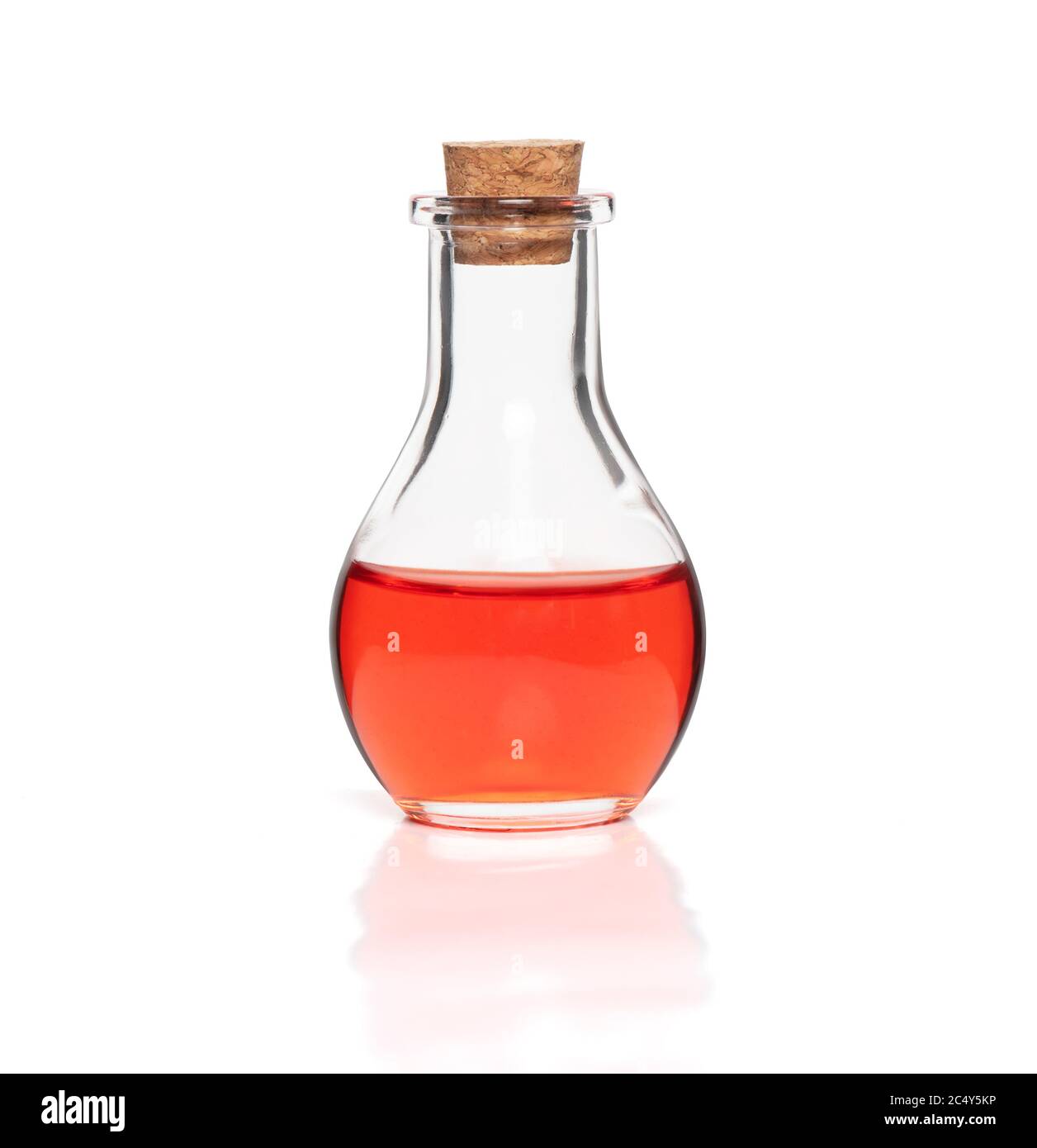 red liquid in a glass bottle. Isolated on white with clipping path ...