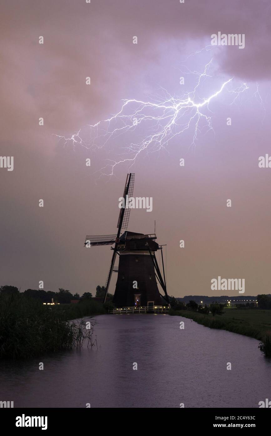 Lightning bolt over a classic dutch windmill Stock Photo - Alamy