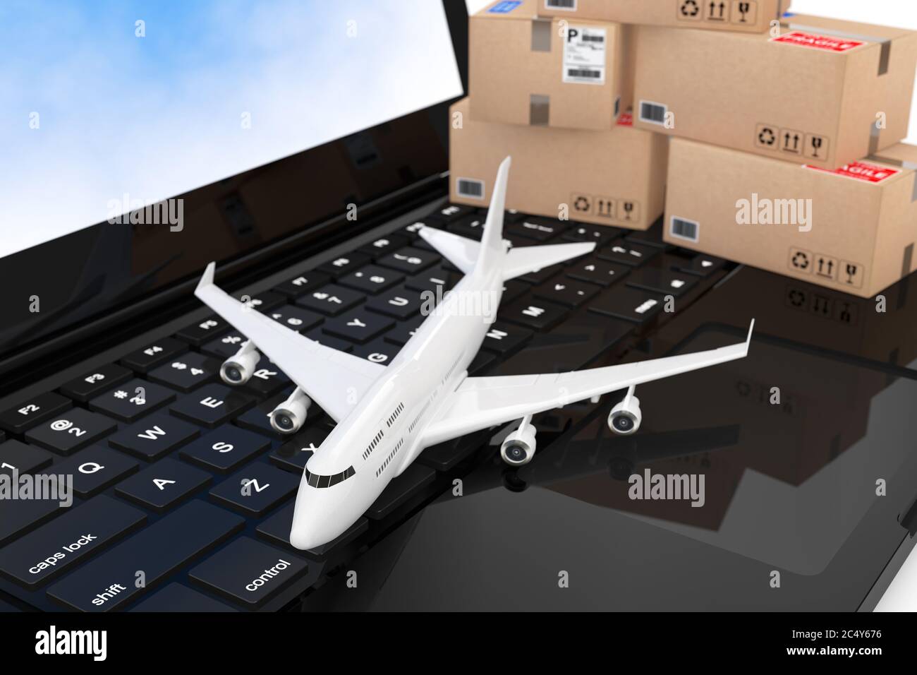 White Jet Passenger's Airplane with Cardboard Boxes over Modern Laptop ...