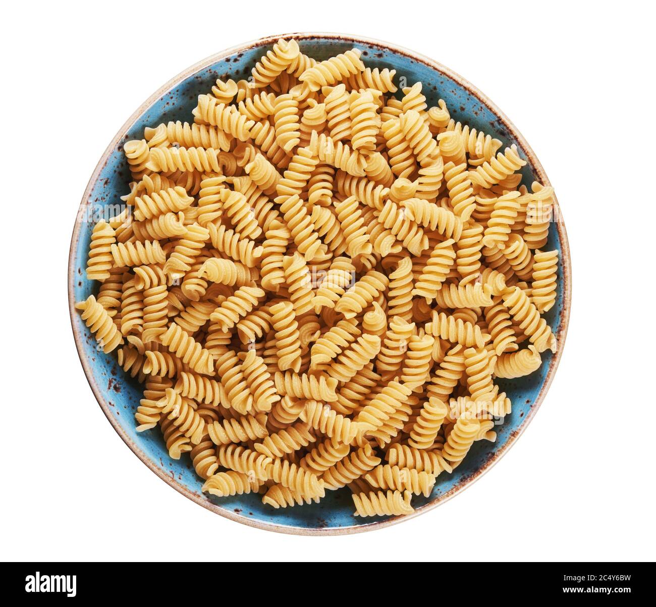 fusilli pasta in a plate isolated on white background. Top view Stock ...