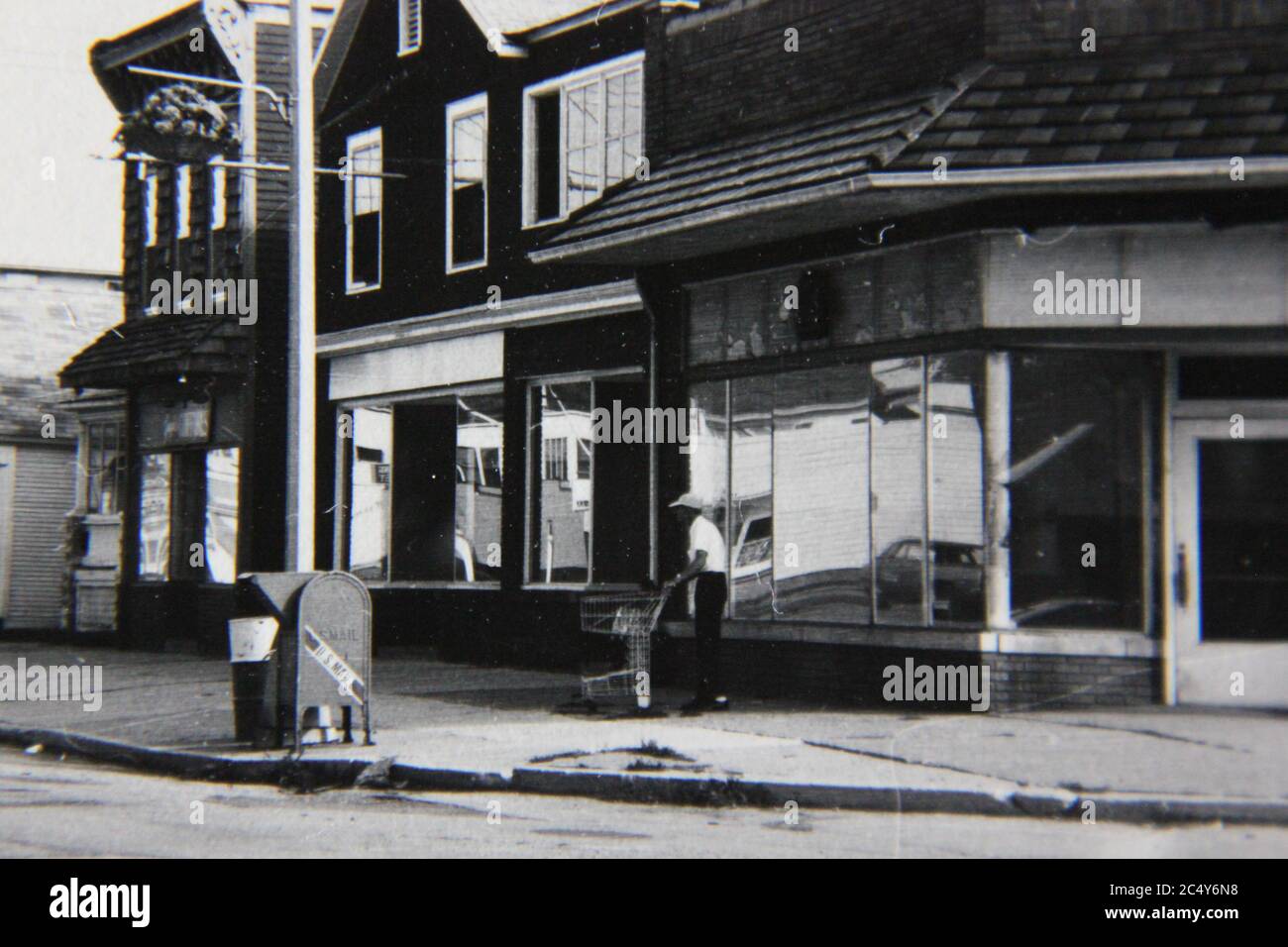 Fine 70s vintage black and white photography of a main street filled ...