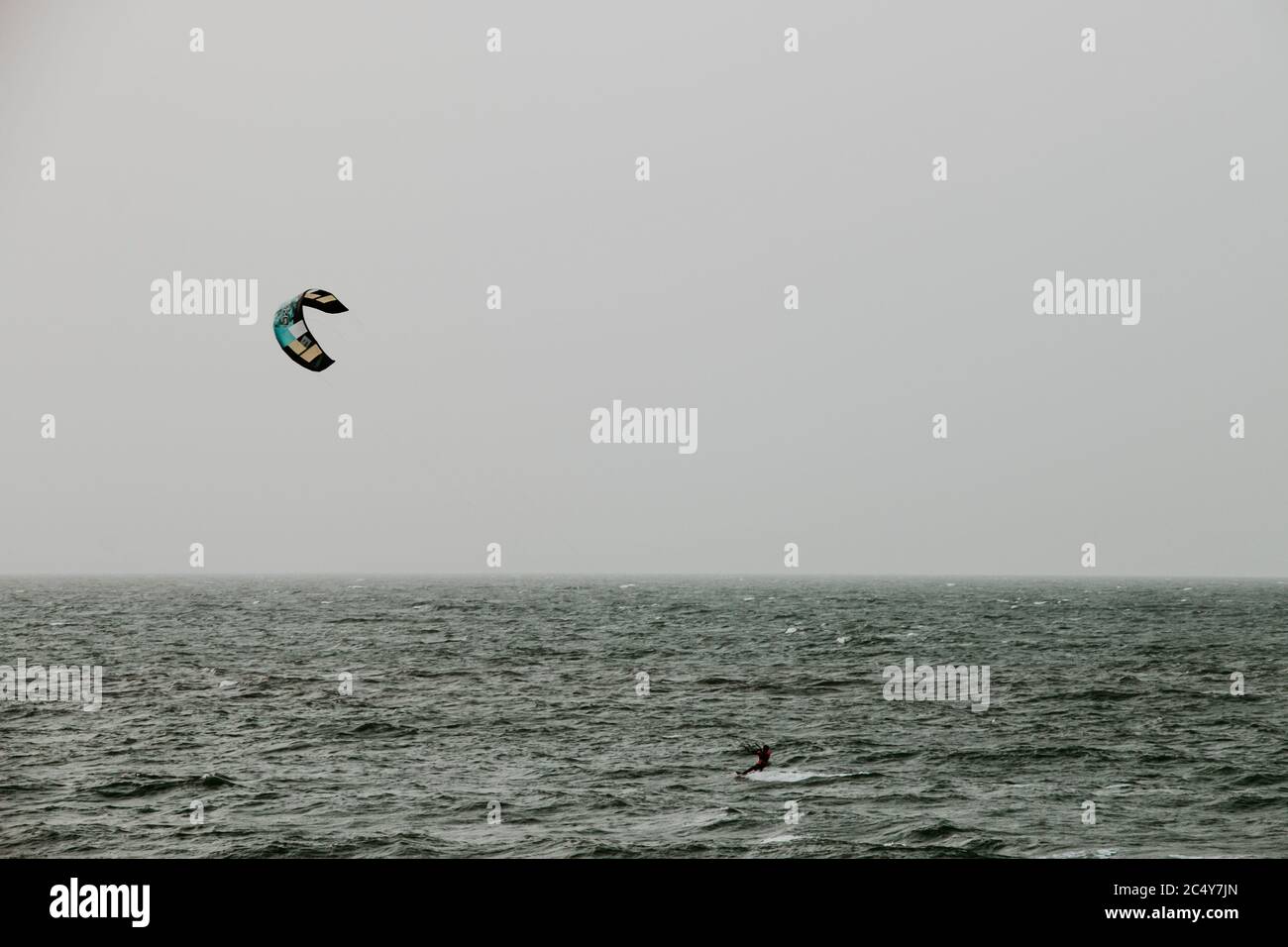Kite surfer drifts through waves on an open Caribbean sea in Cartagena ...