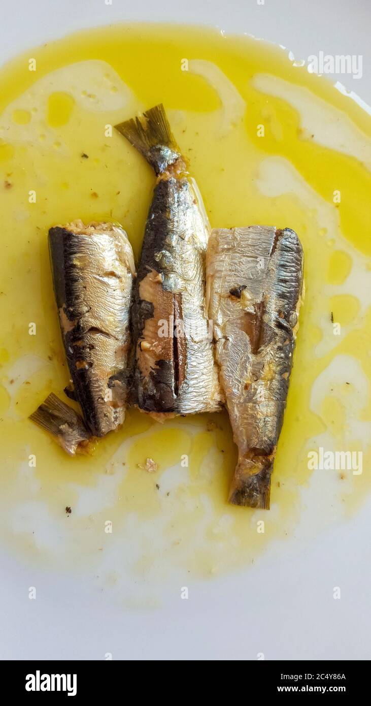Vertical top view of marinated sardines in a plate Stock Photo - Alamy