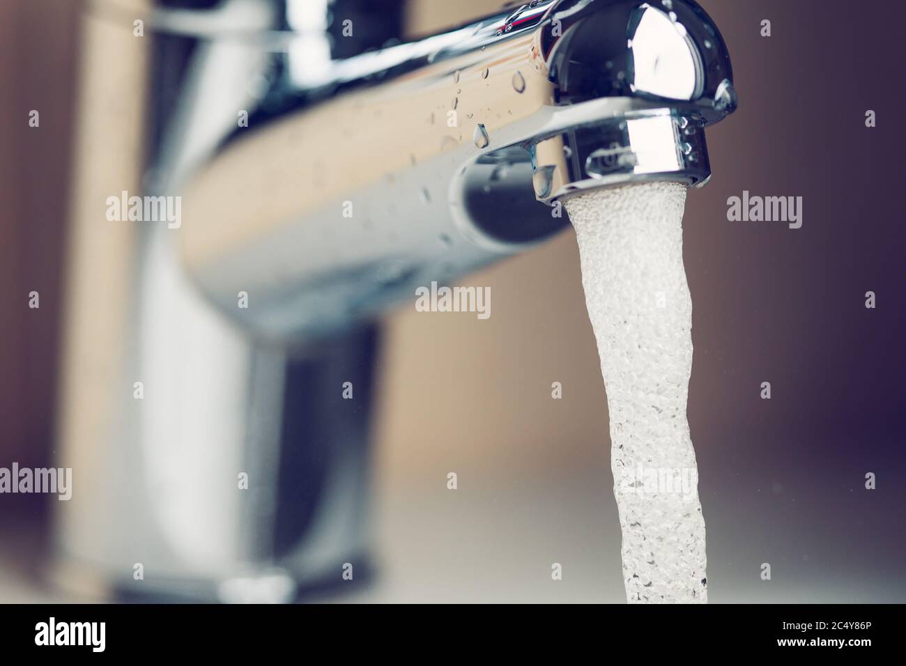 working water tap - water flowing from a basin tap Stock Photo - Alamy