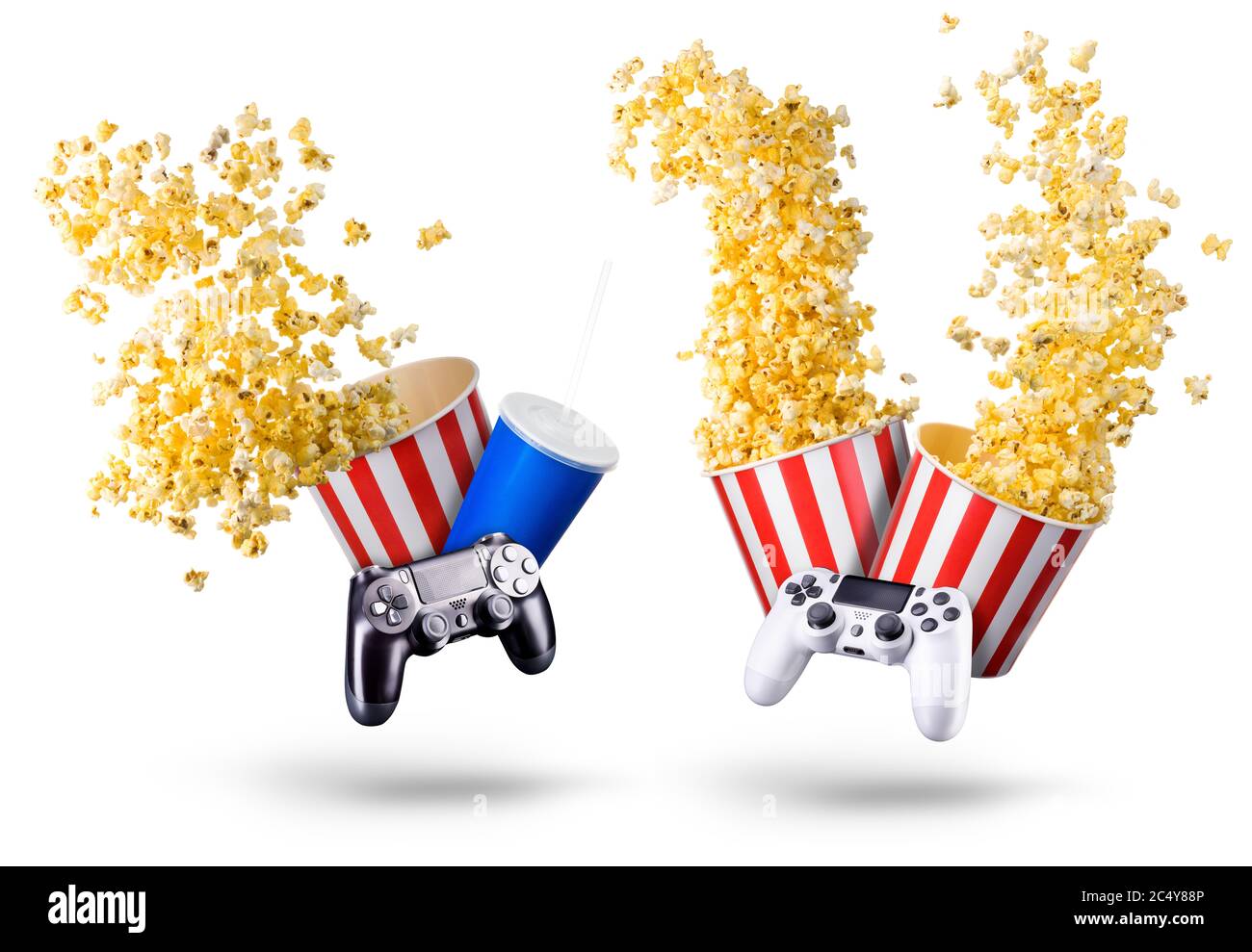 Paper bucket with popcorn, cup of drink and video game joystick on ...