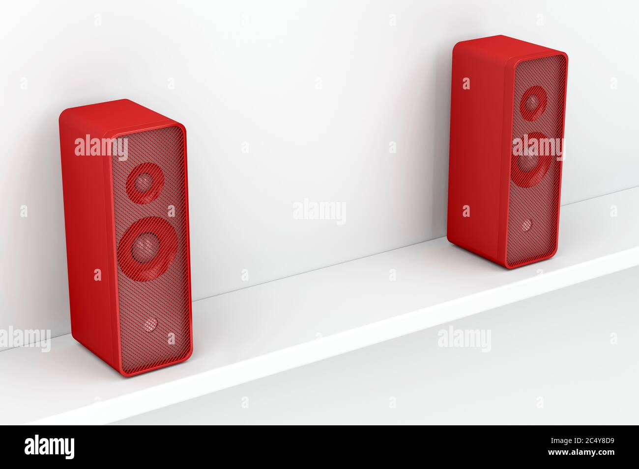 Red stereo speakers on white shelf Stock Photo - Alamy