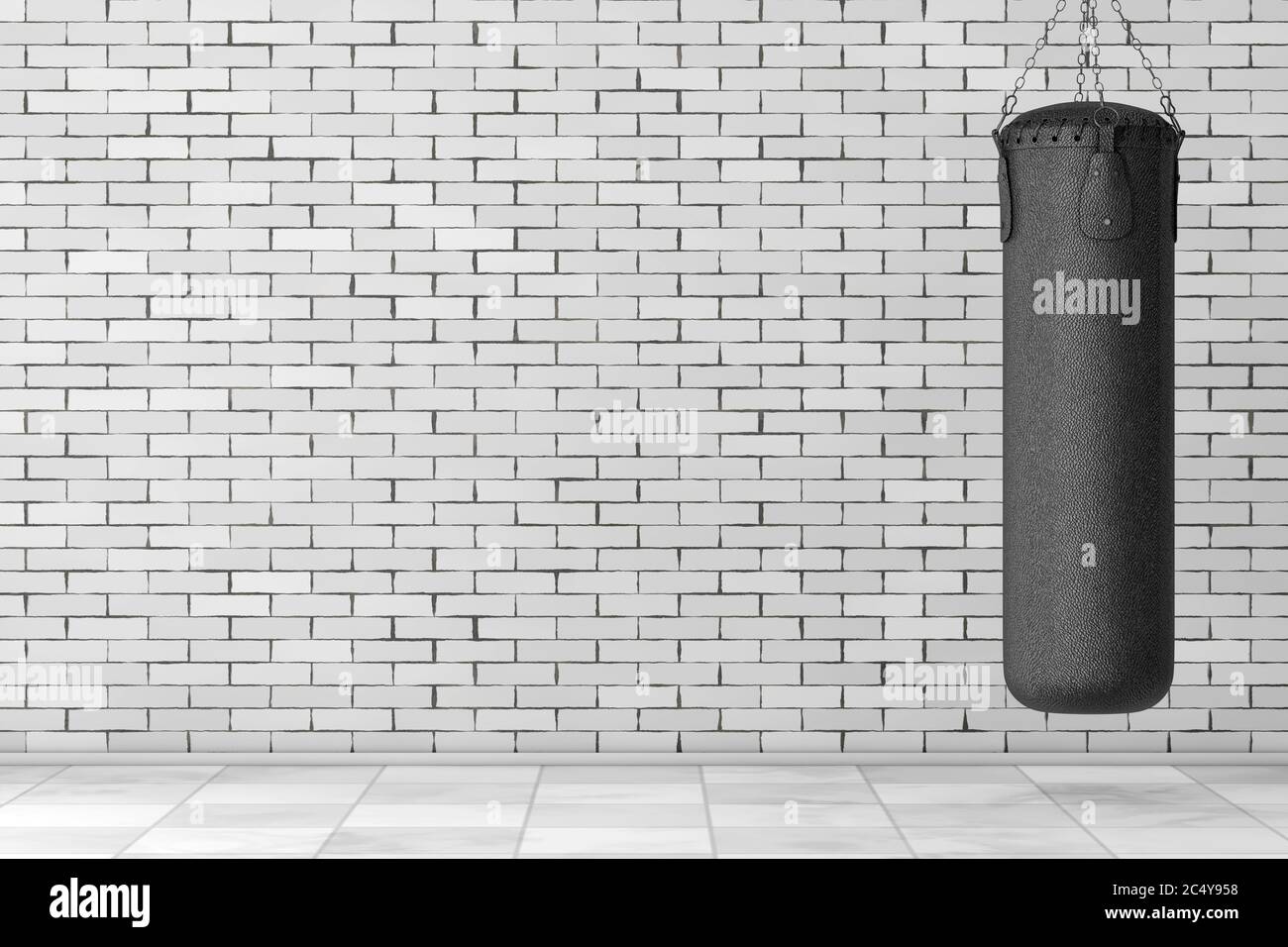 Black Leather Punching Bag for Boxing Training in front of brick wall ...