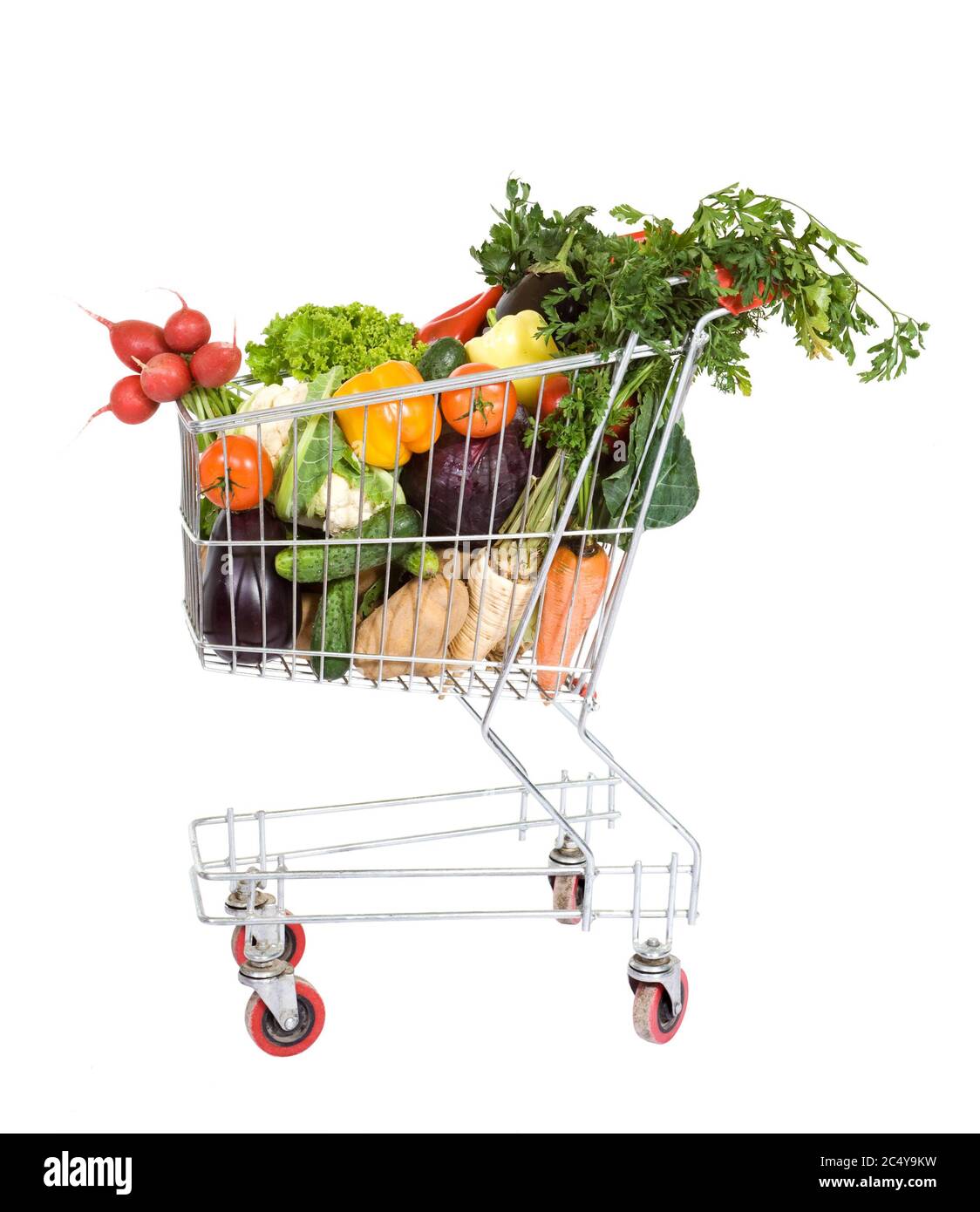 Shopping cart filled with fresh vegetables - isolated Stock Photo - Alamy