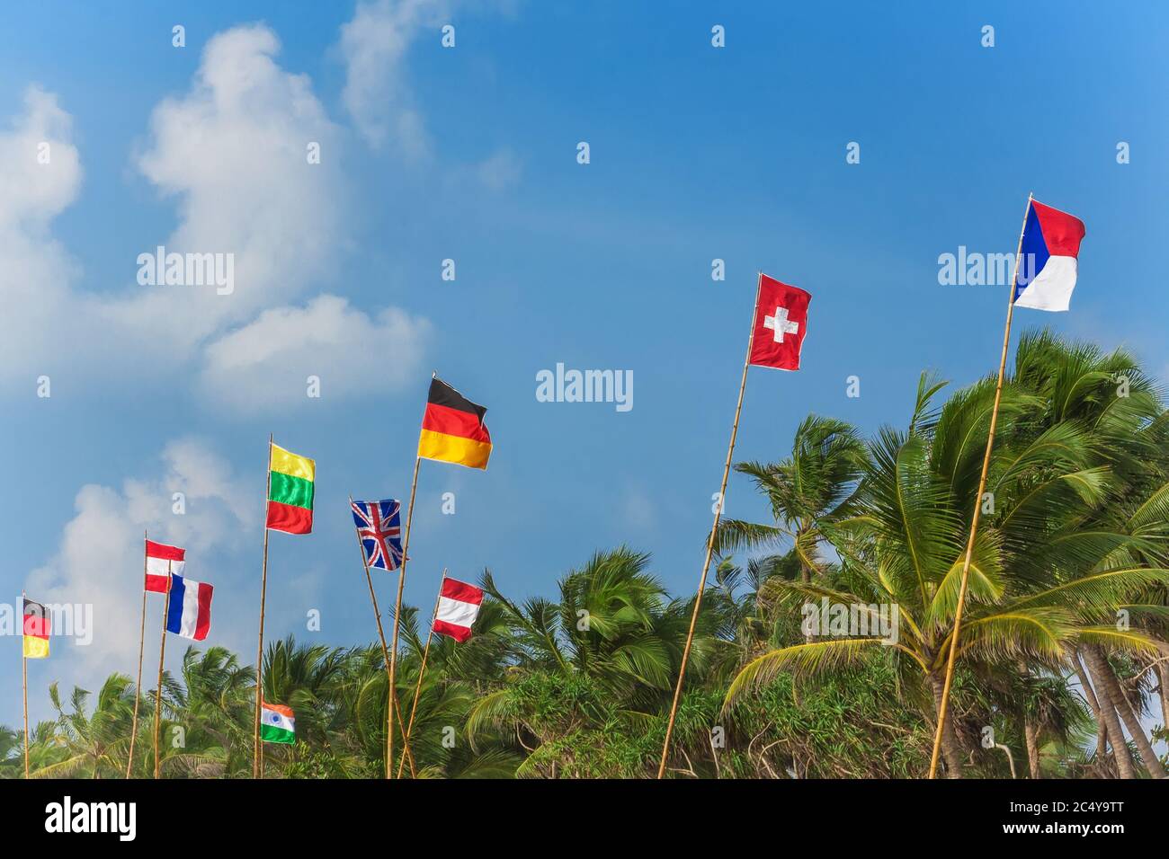 Many National Flags Blowing in the Wind on a Blue Sky Background ...