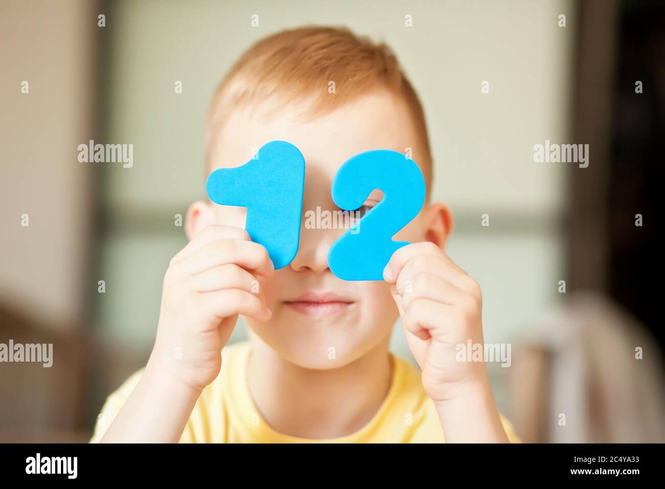 Educational colorful numeral figures in a child hands. Teaching ...