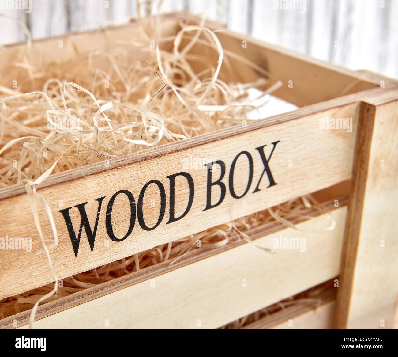 Wooden box with straw. universal packaging. rustic style Stock Photo ...