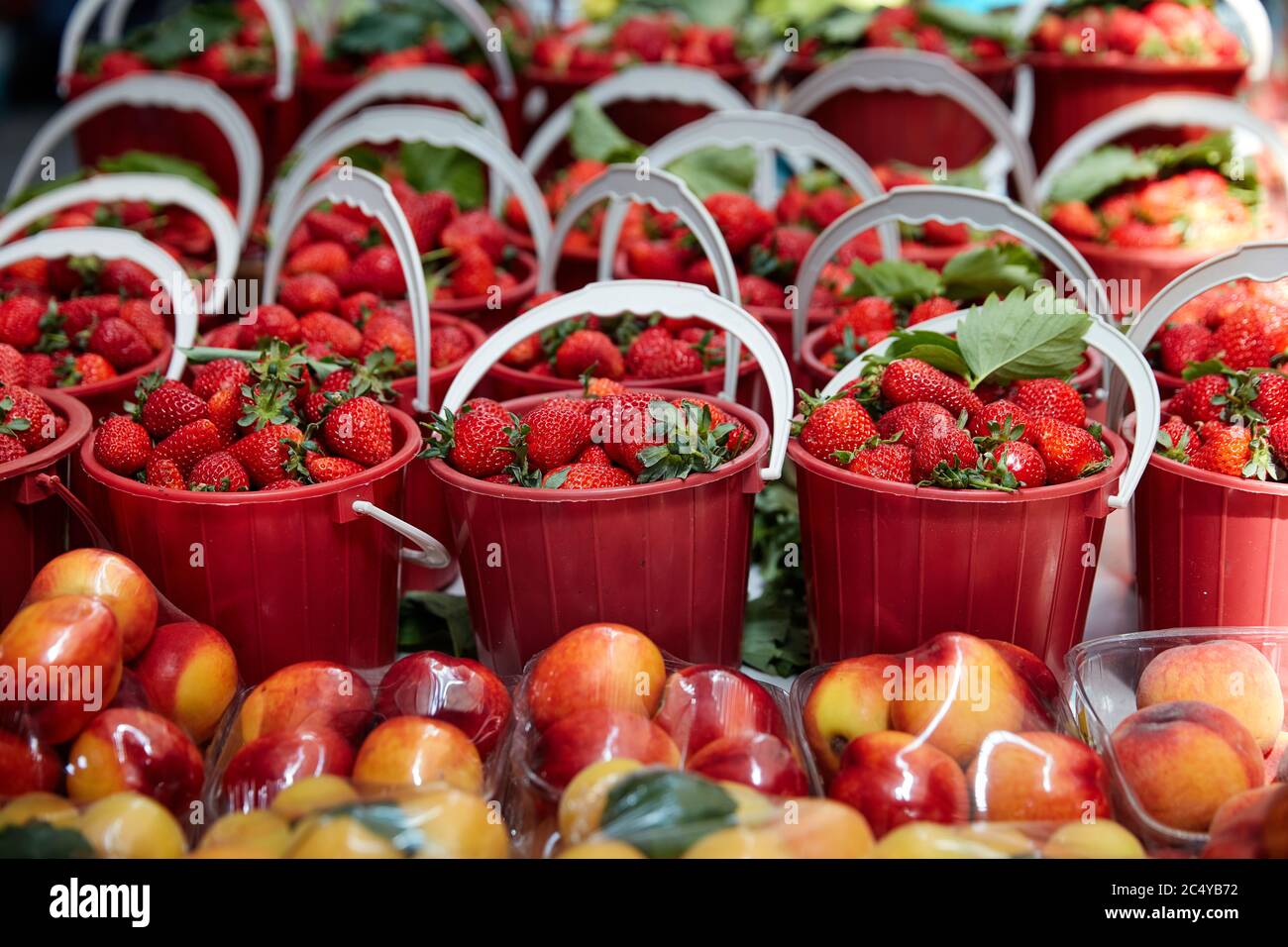Strawberries in a bucket. products in the Eastern market. bazaar Stock ...