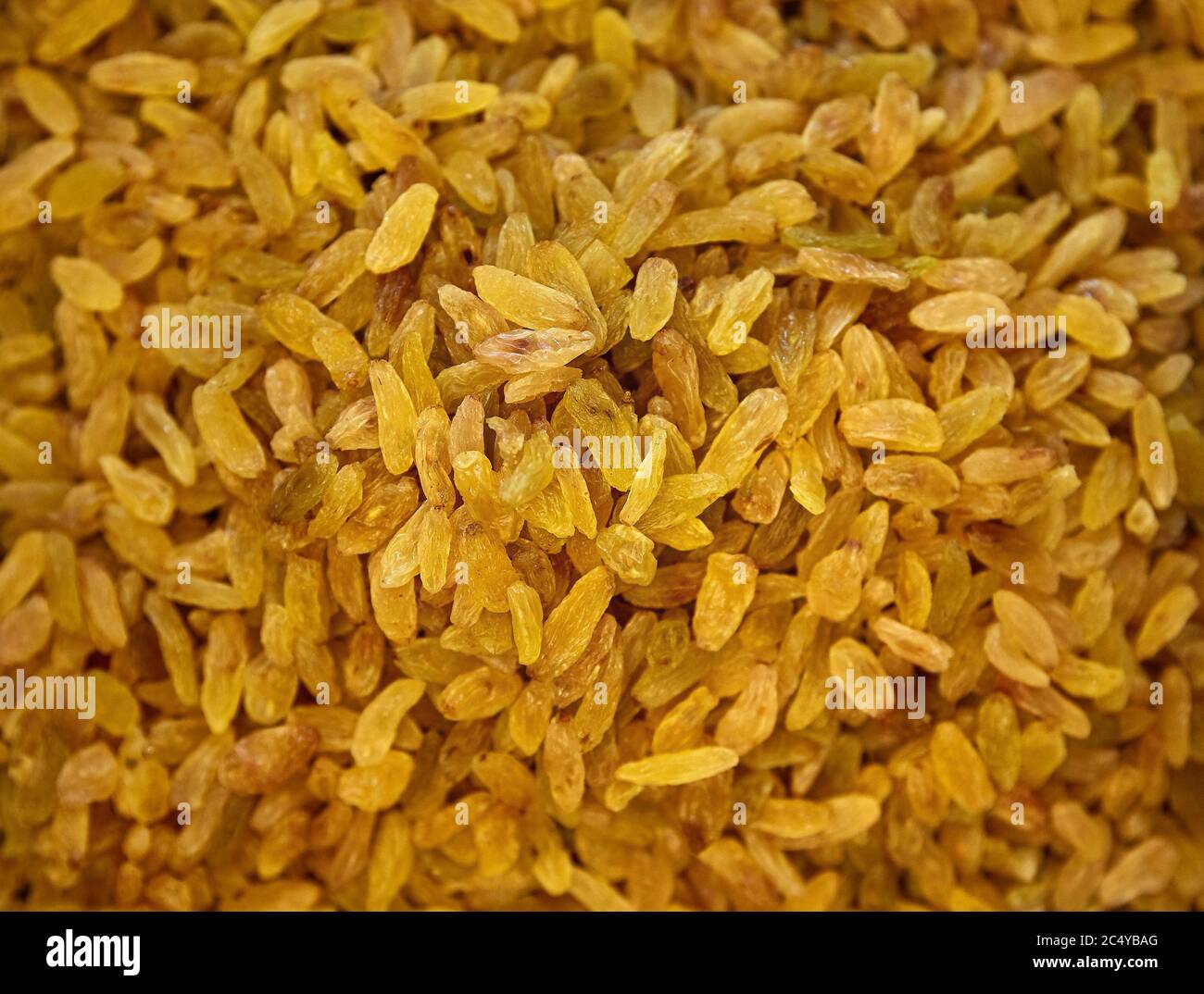Raisins Background. Yellow Sultanas. Golden Dried Seedless Grapes Top View Stock Photo - Alamy