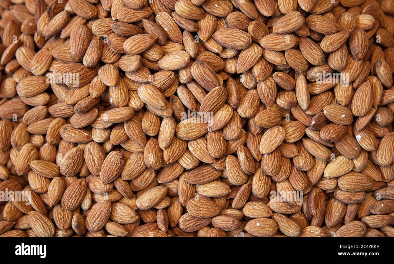 Pile of almonds close-up as background. oriental market Stock Photo - Alamy