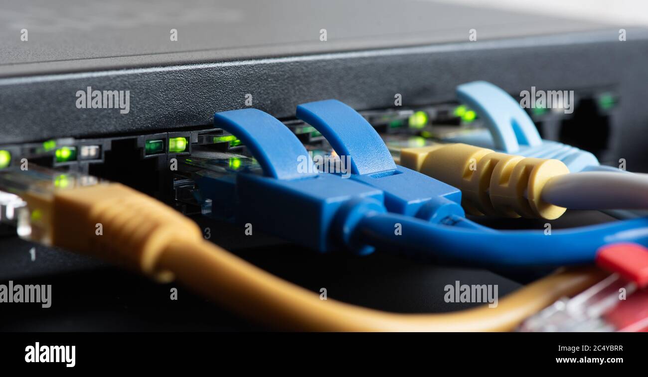 Ethernet cables connected to network switch, close up Stock Photo - Alamy