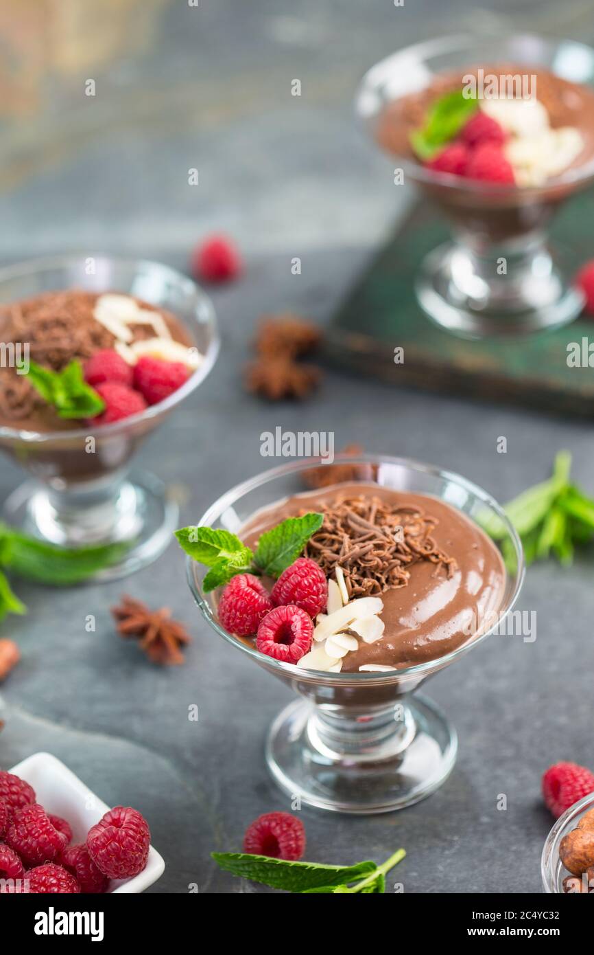 Chocolate mousse with raspberry, mint and almonds Stock Photo - Alamy