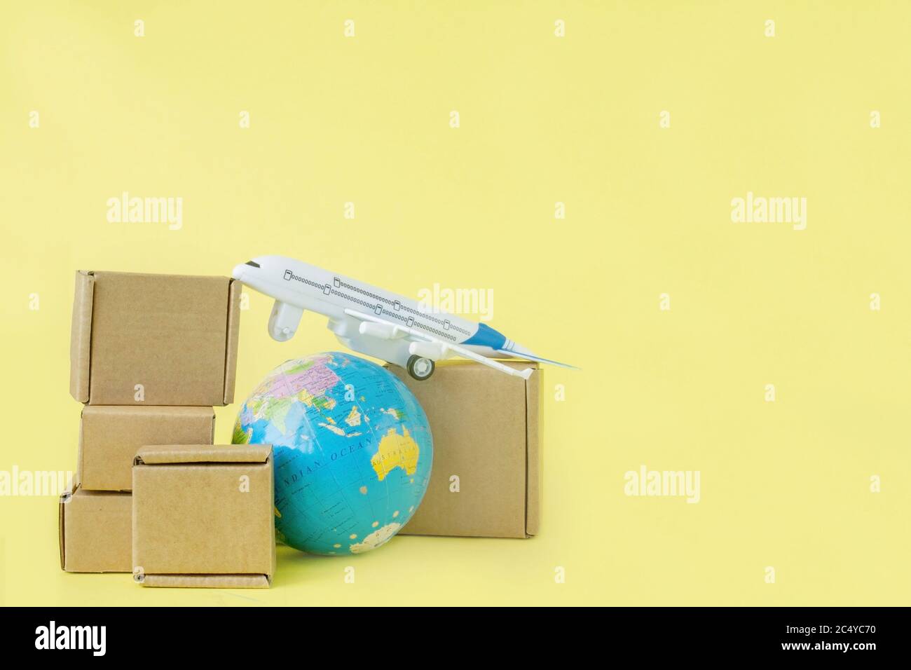 Airplane and stack of cardboard boxes. concept of air cargo and parcels ...