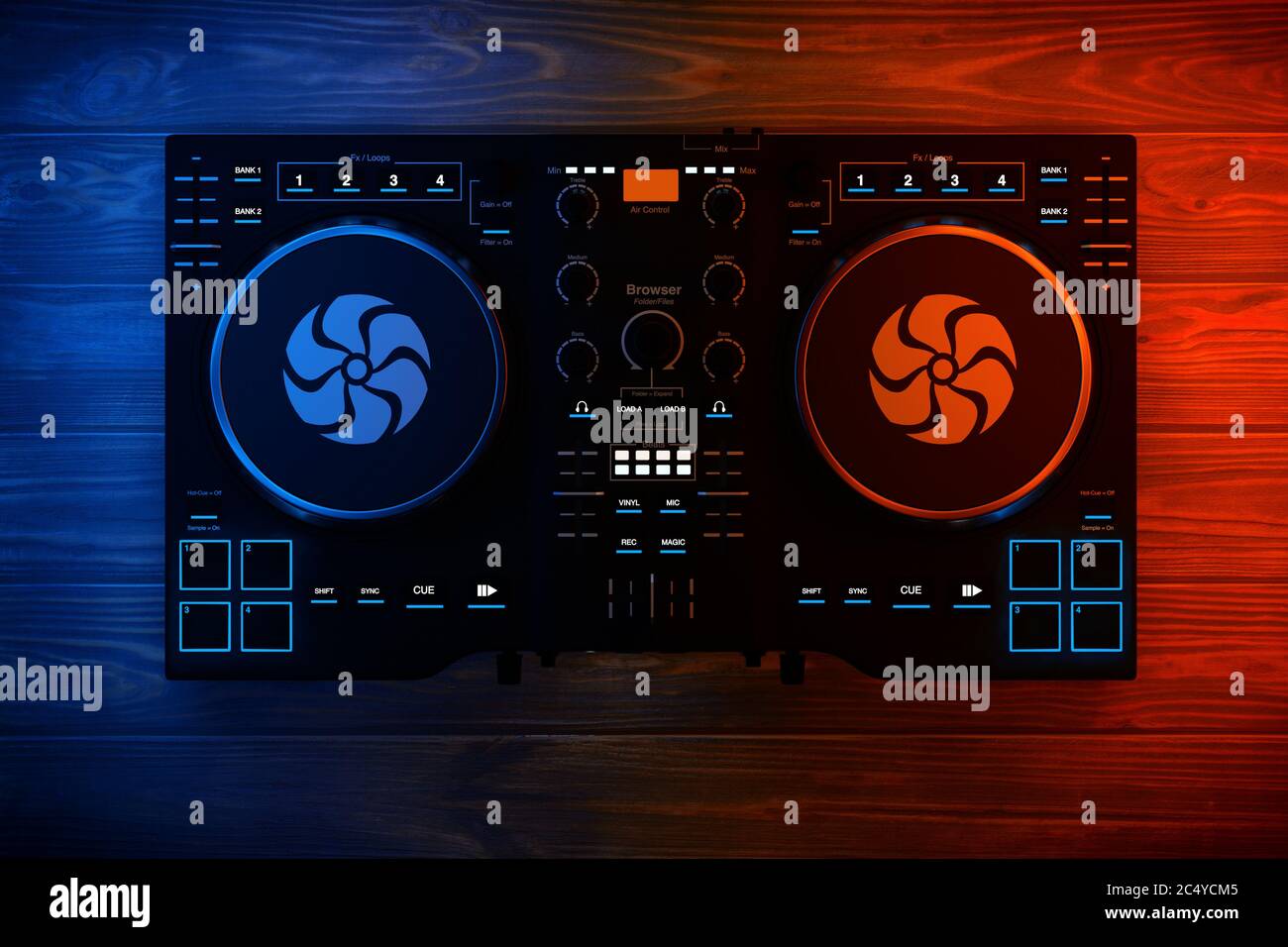 Black Modern DJ Set Turntable Mixer Equipment in Color Lights on a ...