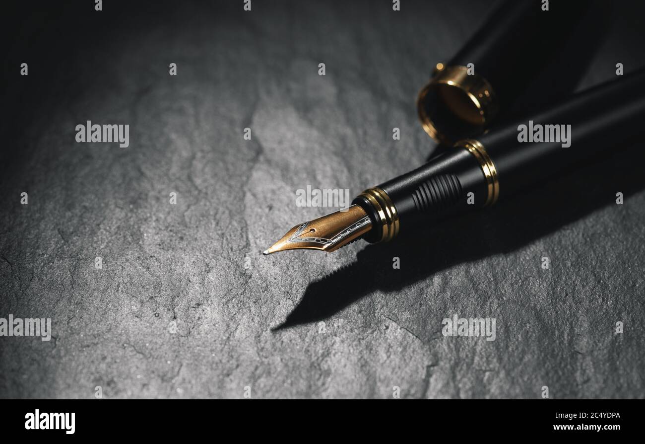 Golden fountain pen hi-res stock photography and images - Alamy