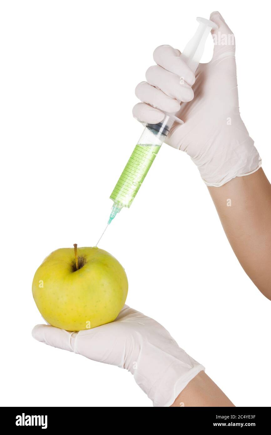 Genetically Modified Products Concept. Fresh Green Apple Being Injected ...