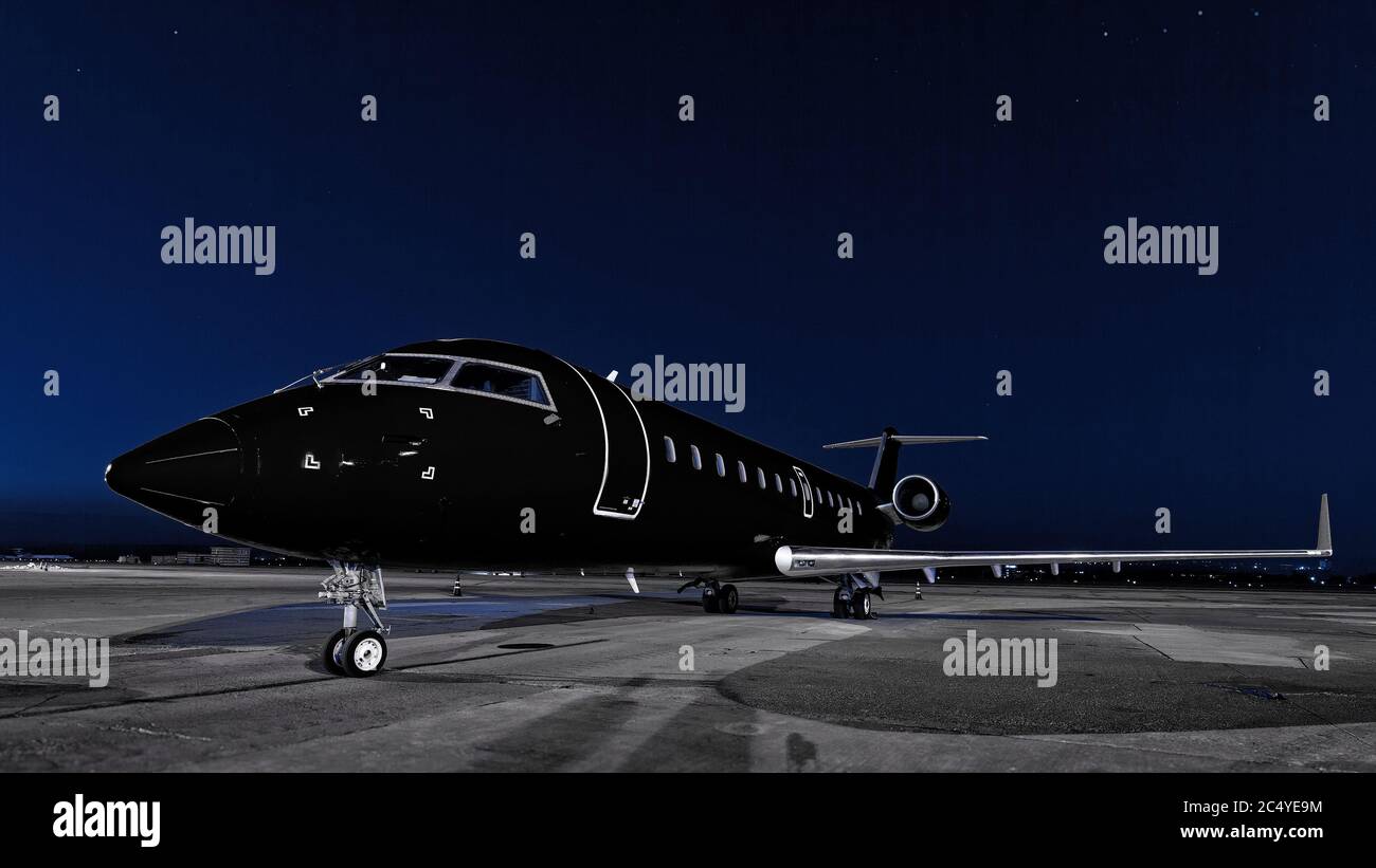 business jet. black plane is parked Stock Photo - Alamy