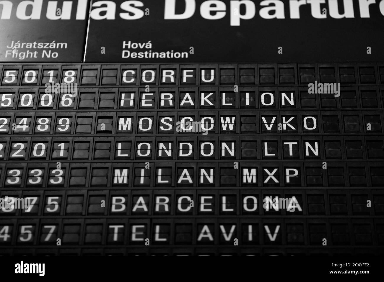 Departures board at the airport. Flight information mechanical ...