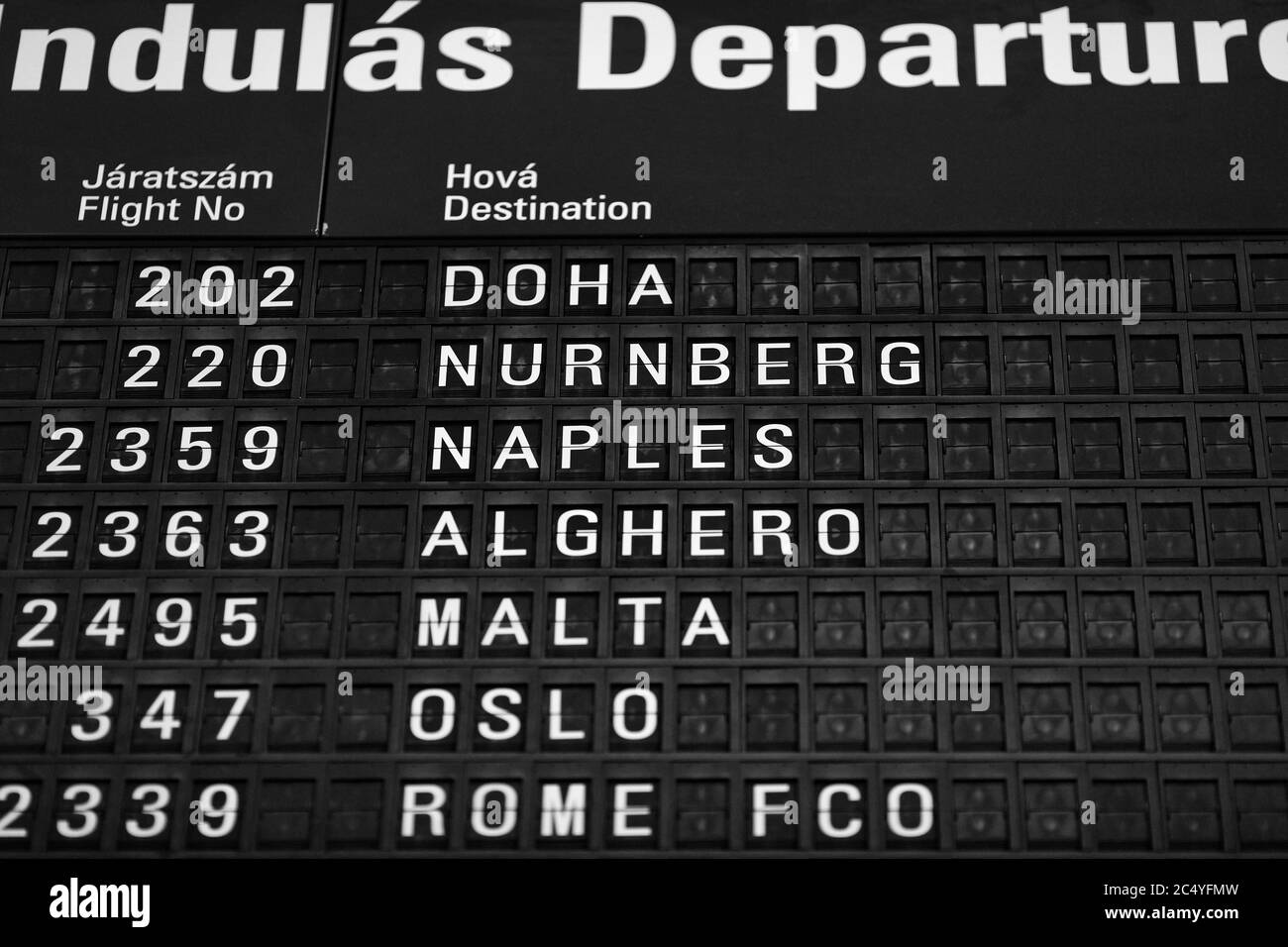 Departures board at the airport. Flight information mechanical ...