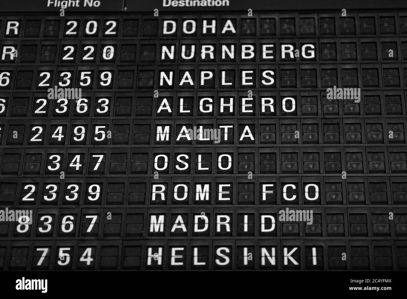 Departures board at the airport. Flight information mechanical ...