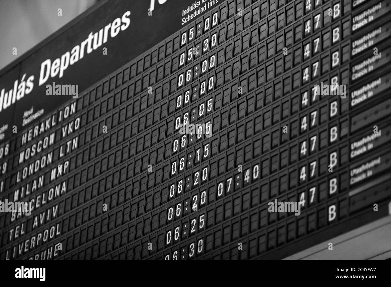 Departures board at the airport. Flight information mechanical ...