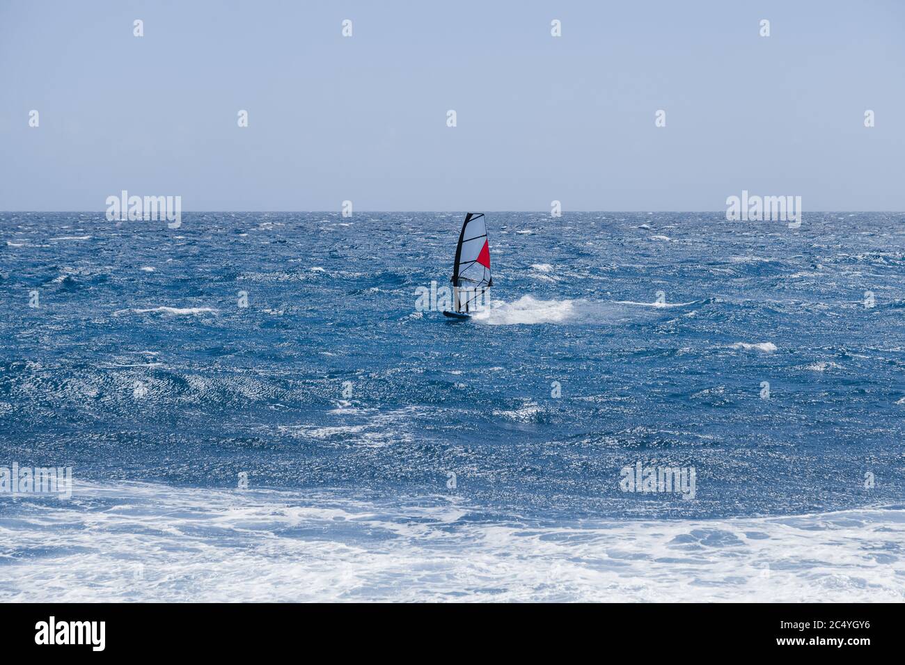 Windsurfing sails on the blue sea Stock Photo - Alamy