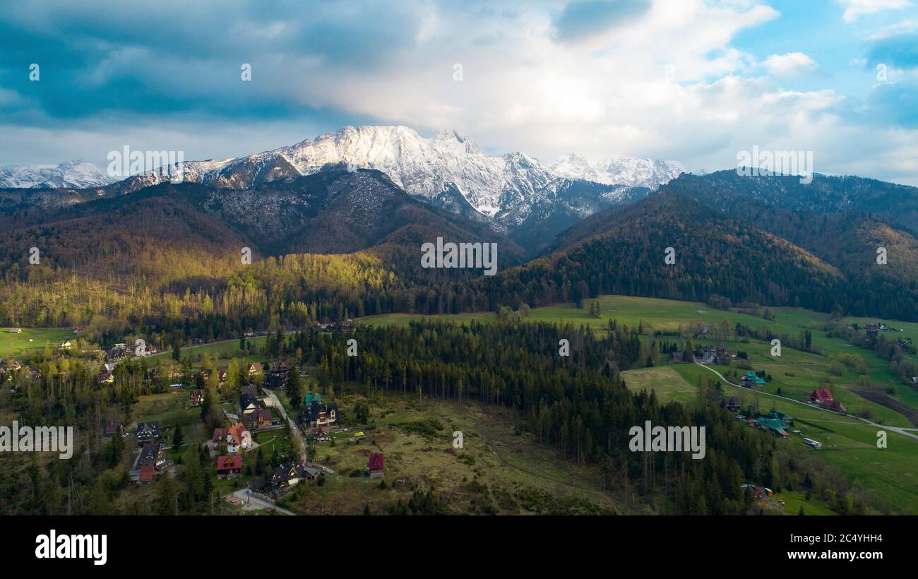 Aerial view of mountains covered with snow in summer or spring. Giewont ...