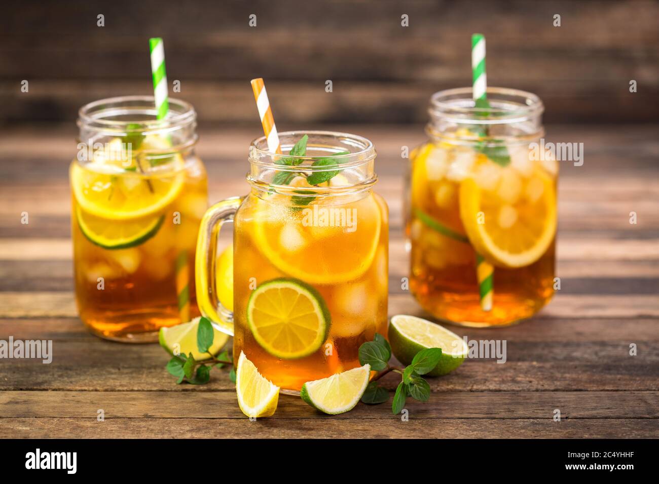 Ice tea with lemon, lime and mint Stock Photo - Alamy