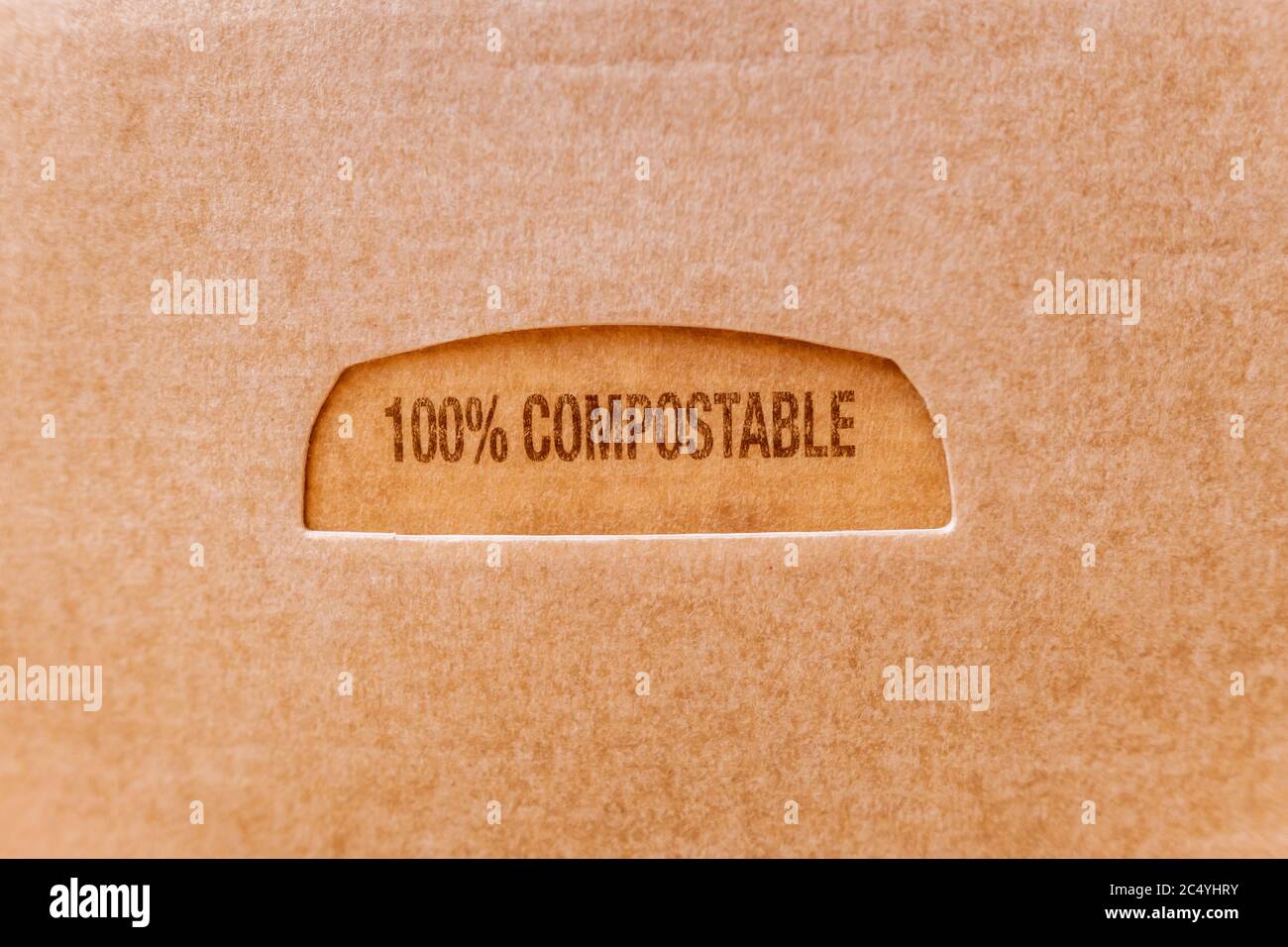 100% compostable text on a recycled cardboard box Stock Photo - Alamy